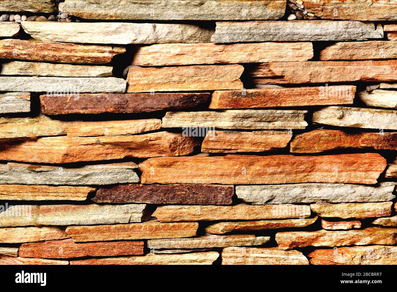 Stone background shale laid with layers of brown color of heterogeneous ...
