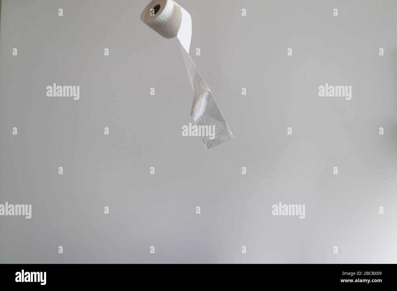 artistic concept shot of flying toilet paper roll Stock Photo - Alamy