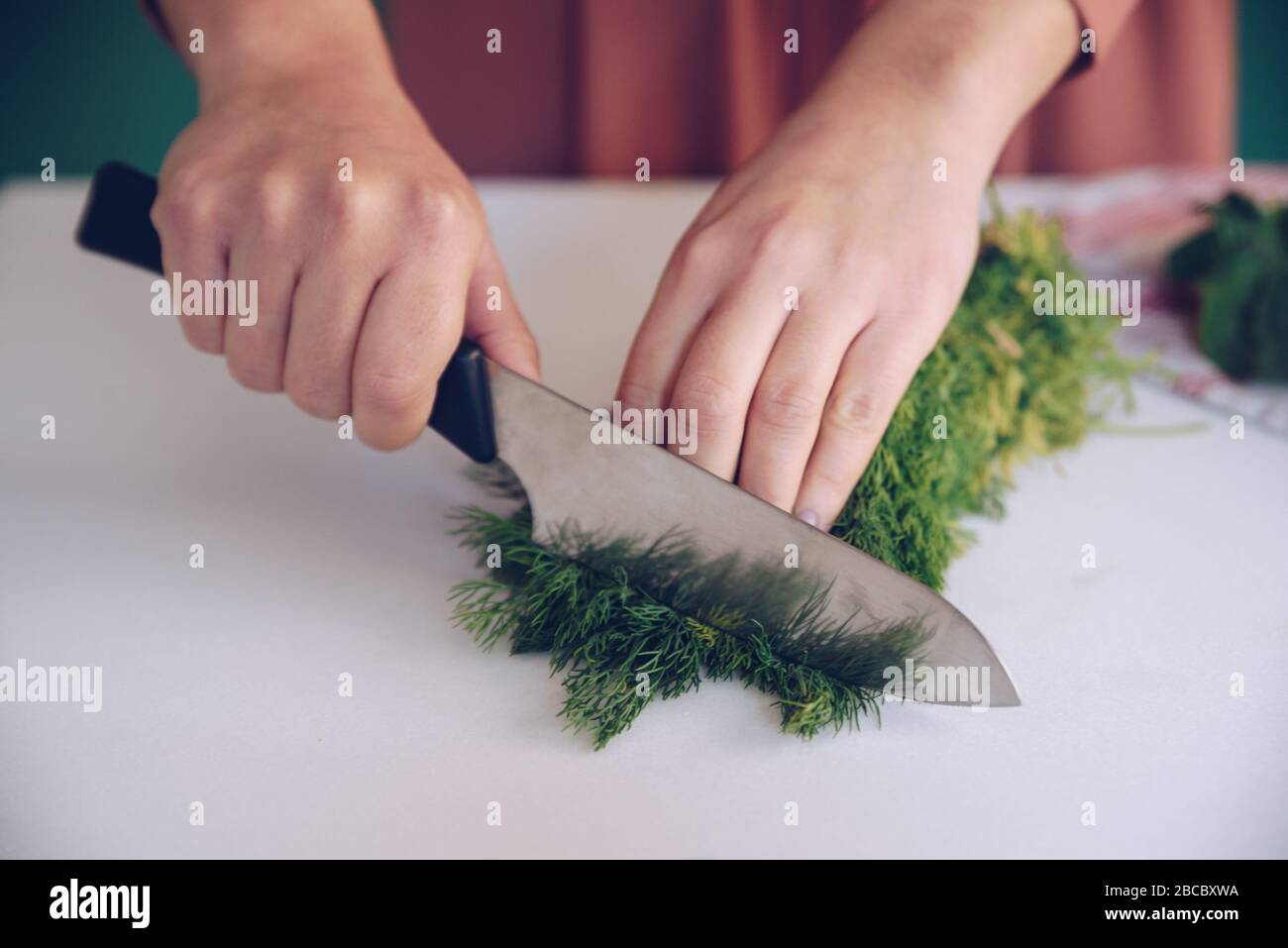 Cutting dill chef cut knife hi-res stock photography and images - Alamy