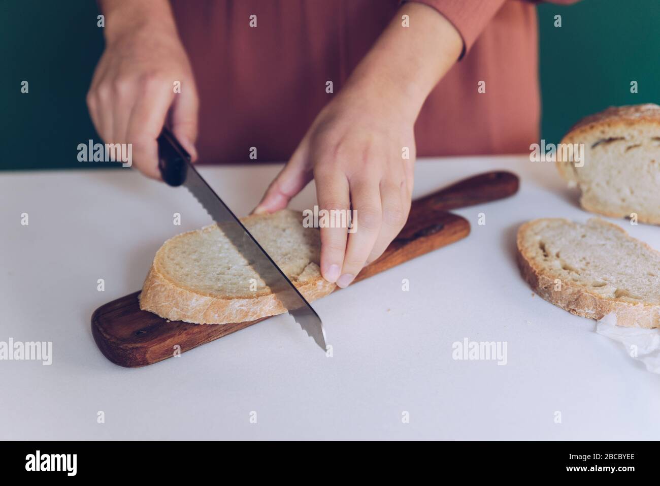 Hand with knife cutting butter hi-res stock photography and images - Alamy