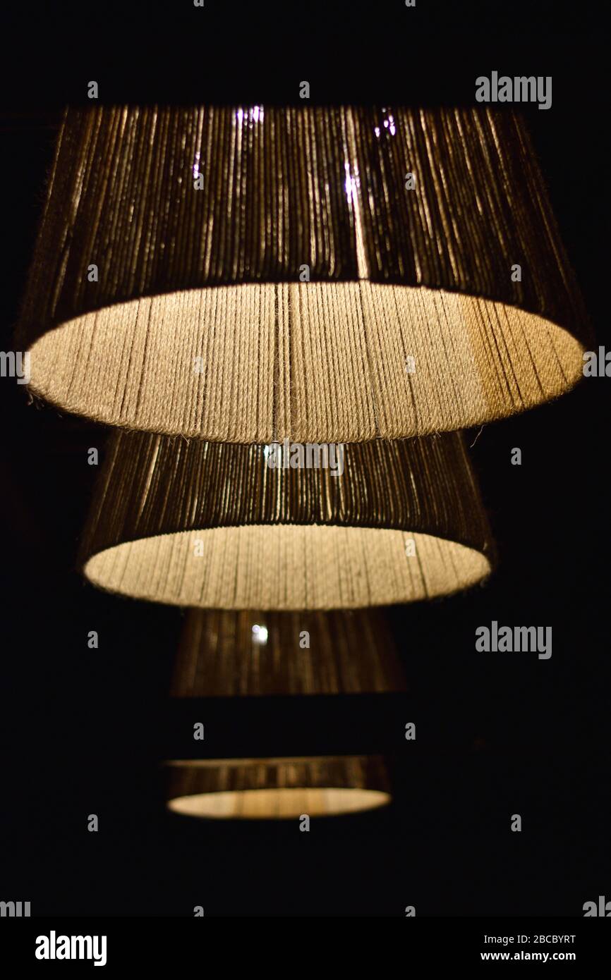 3 straw lamps in the dark indoors Stock Photo - Alamy