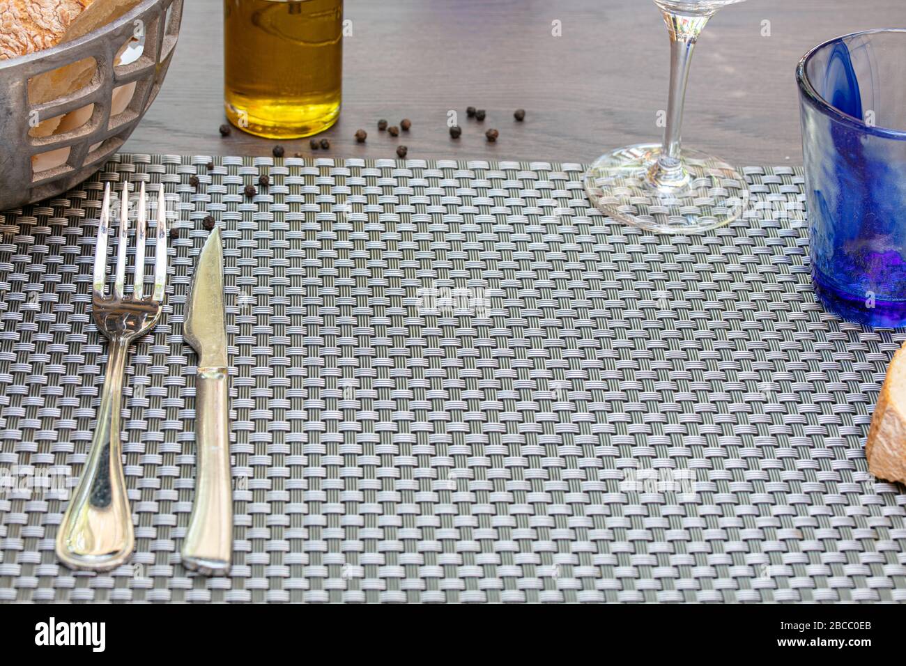 Table with cutlery in a restaurant Stock Photo - Alamy