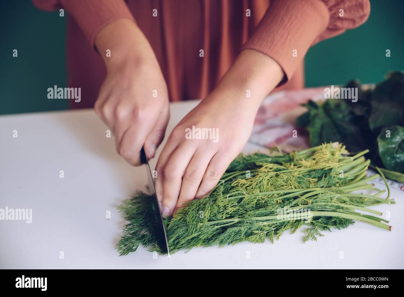 Cutting dill chef cut knife hi-res stock photography and images - Alamy