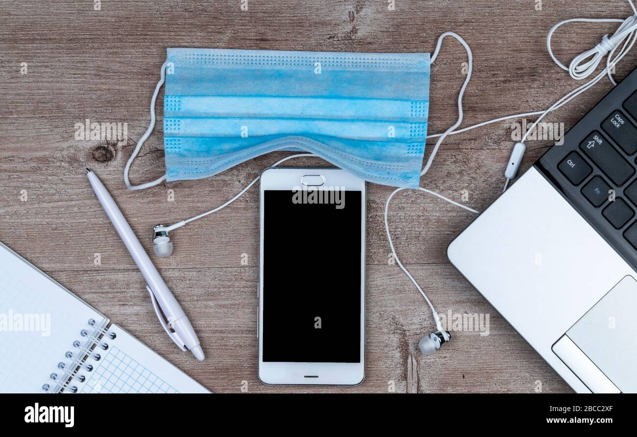 hygiene in the office. remote work kit on wooden desk. sanitizer gel ...