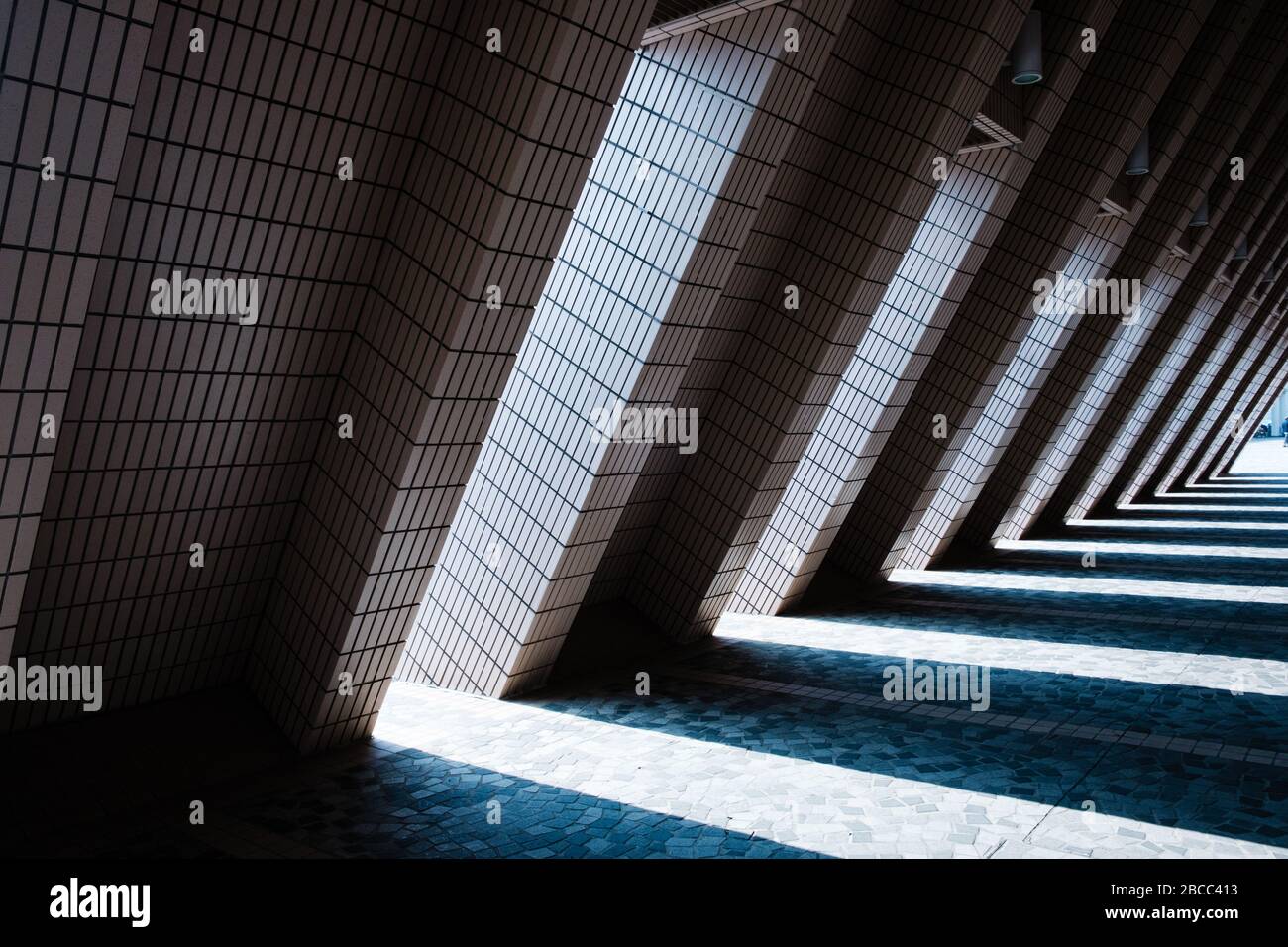 urban architecture tunnel , triangle shape corridor Stock Photo - Alamy