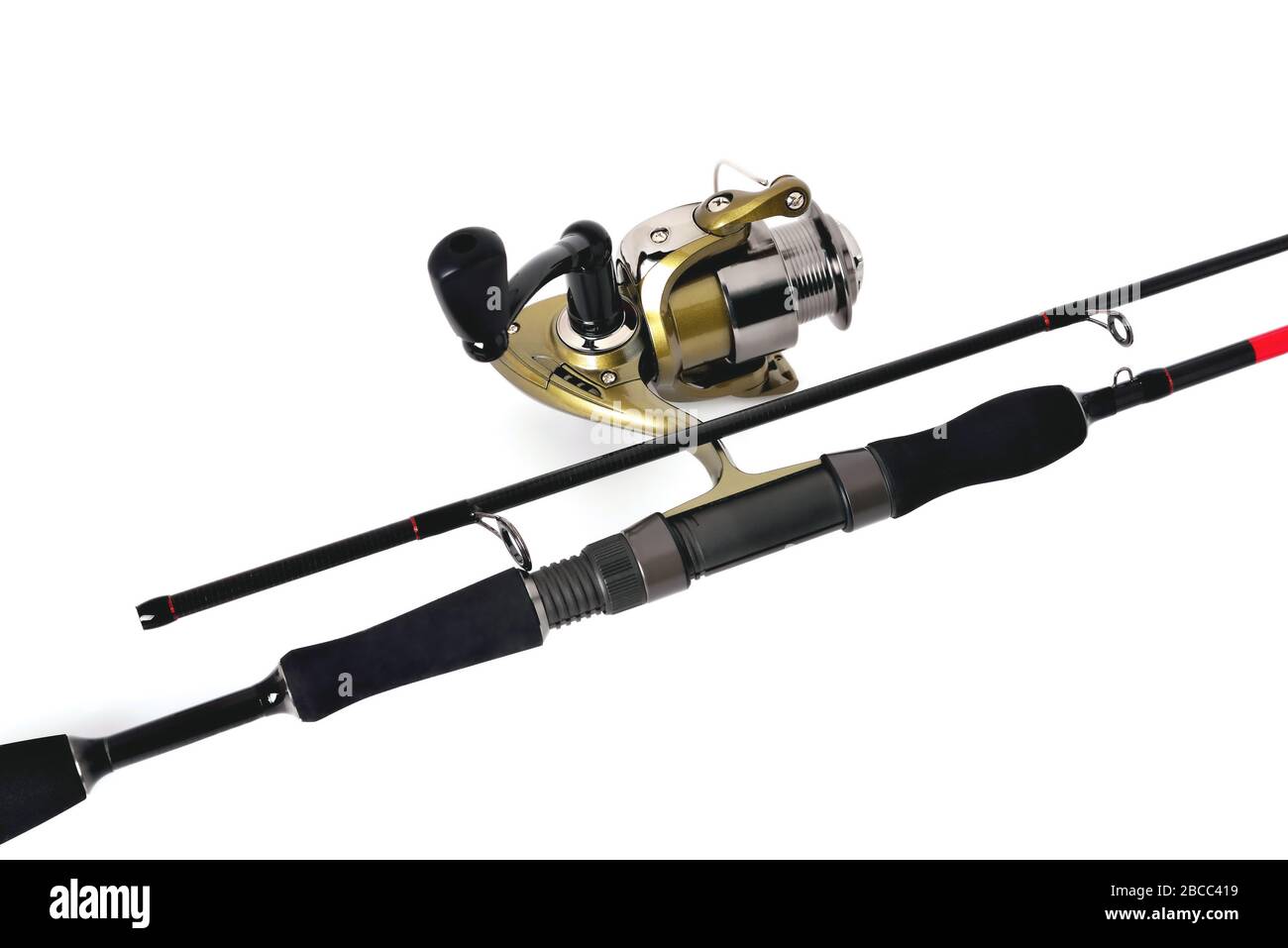 fishing reel on a fishing rod, white background close-up, copy space ...