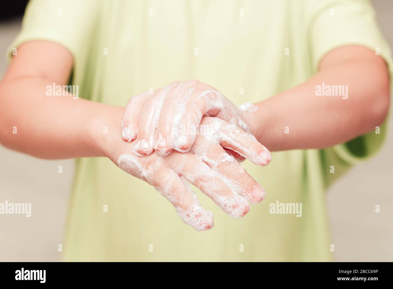 Baby boy cleaning his hands with soup, personal hygiene concept Stock ...