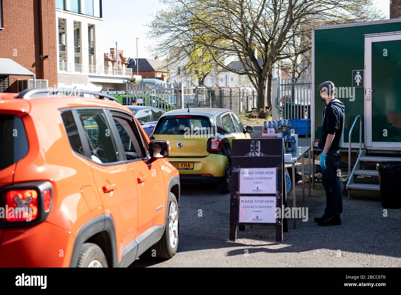 Staff at the Castle Rock Brewery operating a drive-thru beer collection ...