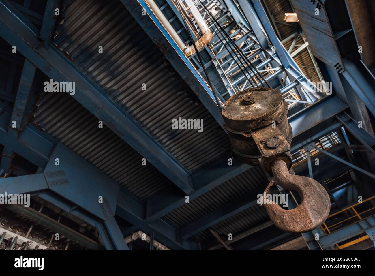 Interior of an old abandoned industrial steel factory Stock Photo - Alamy