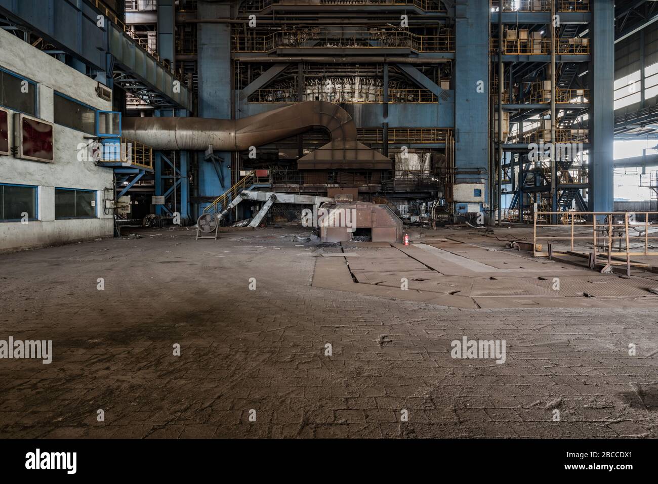 Interior of an old abandoned industrial steel factory Stock Photo - Alamy