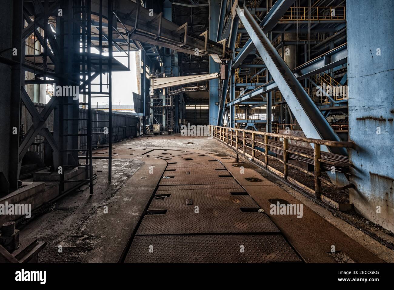 Interior of an old abandoned industrial steel factory Stock Photo - Alamy