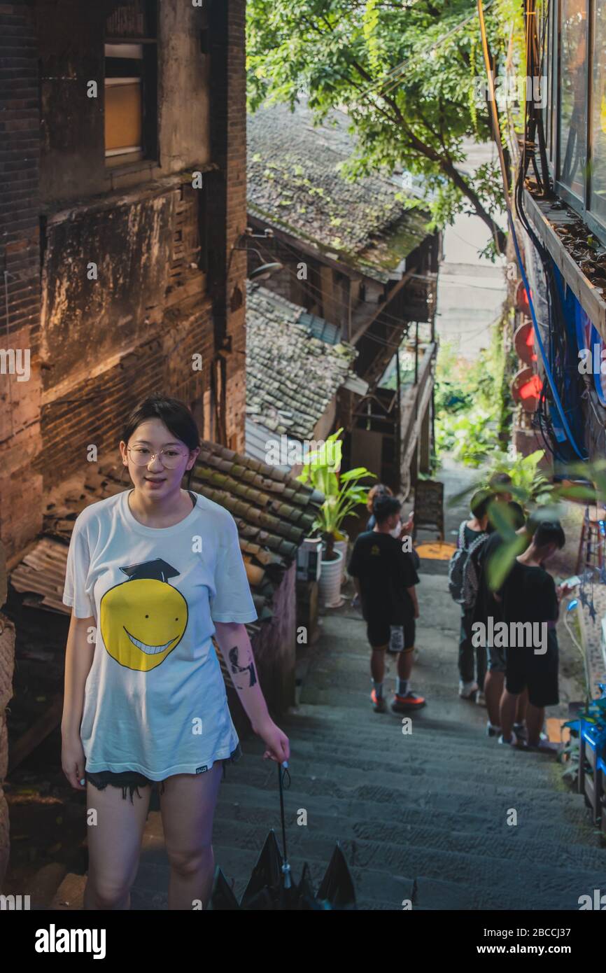 Chongqing, China - August 2019 : Young chinese girl walking on the ...