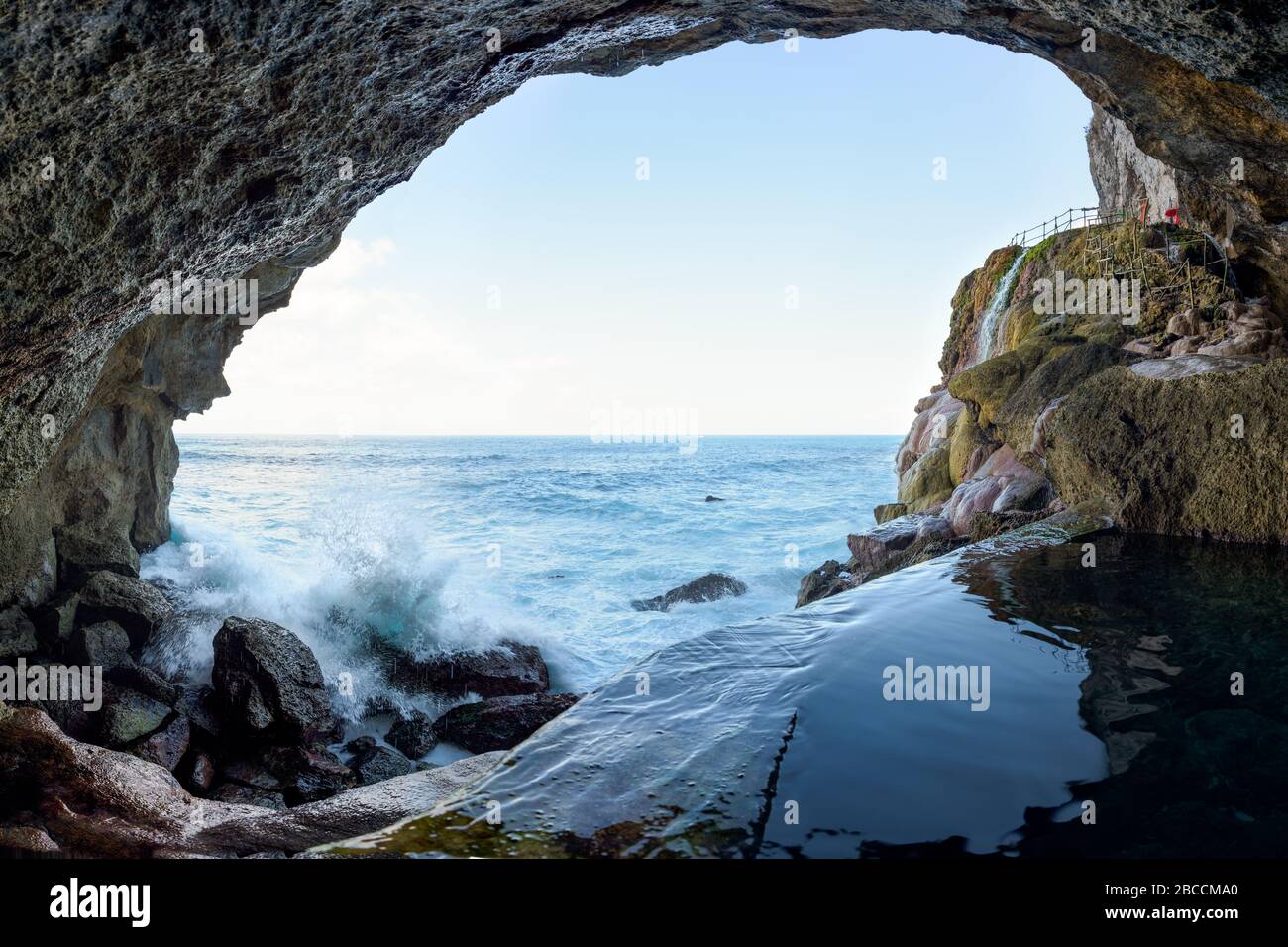 Peguyangan Waterfall balinese temple with sea cave, freshwater pool and ...