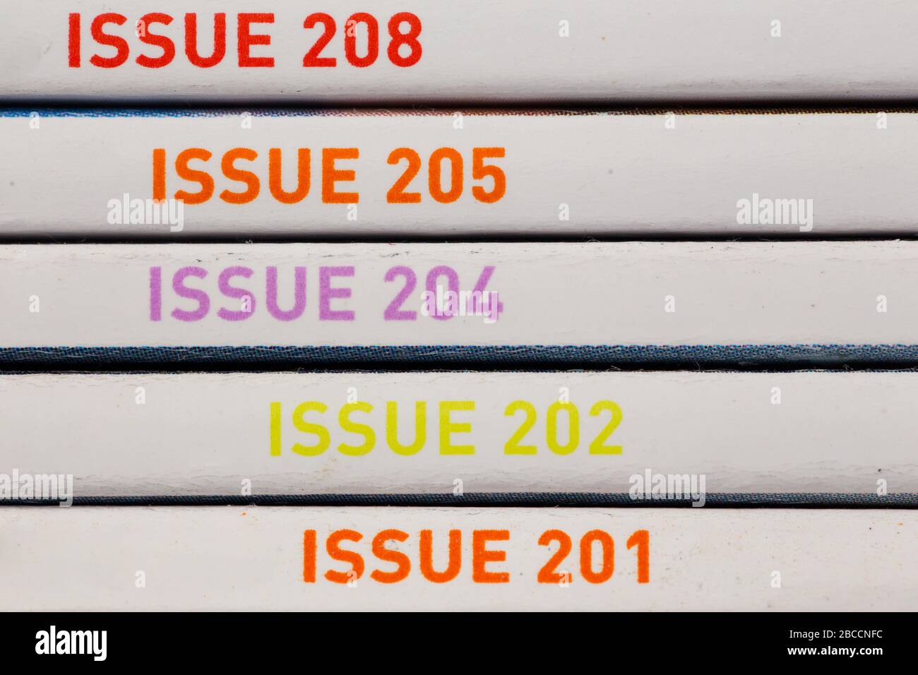 Macro close up view of issue number in red and purple across horizontal ...