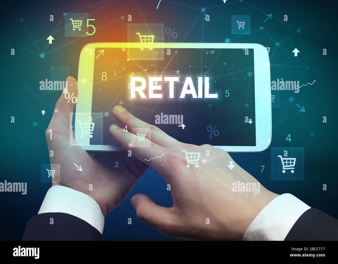 Close-up of a hand holding tablet with RETAIL inscription, online ...