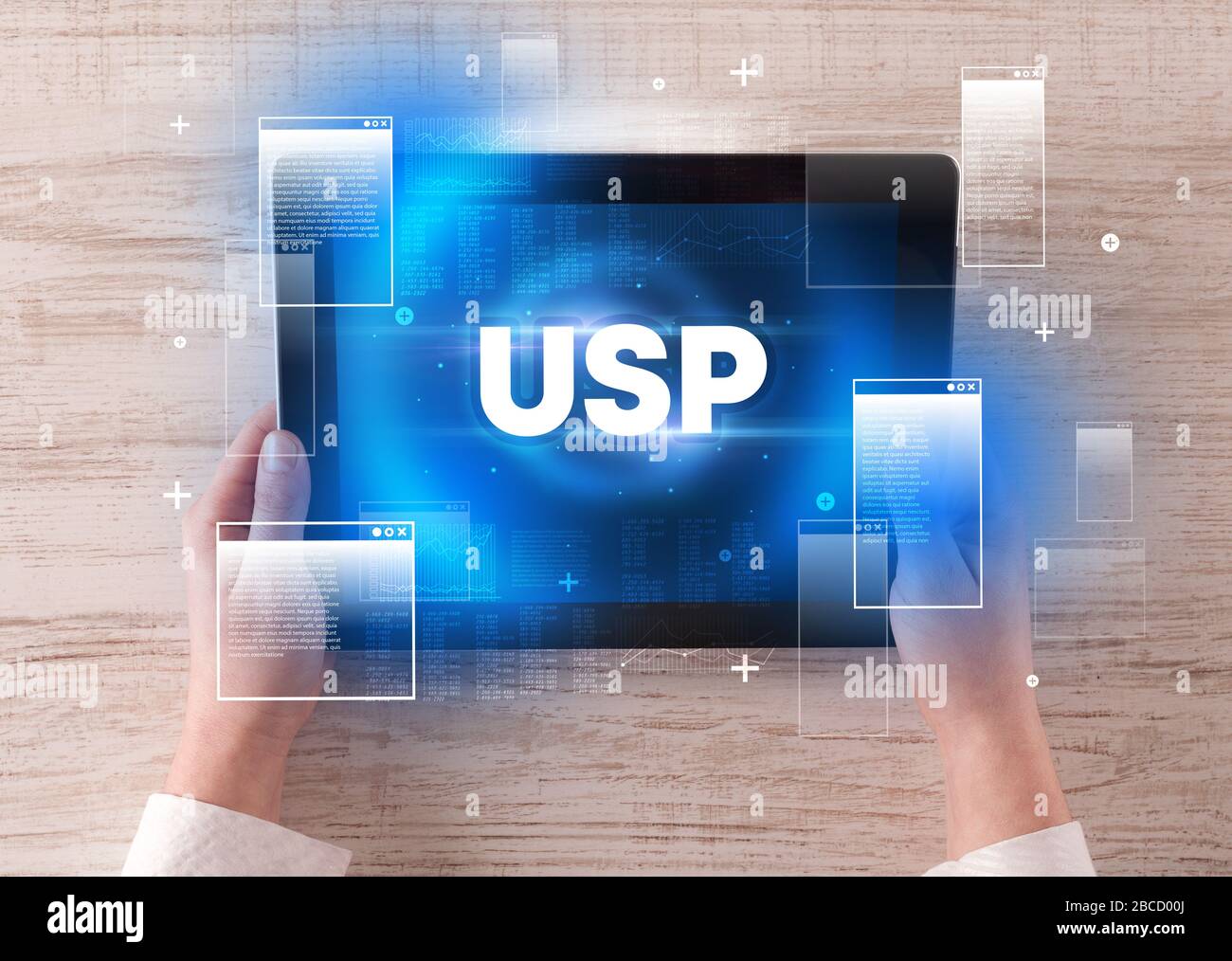Close-up of a hand holding tablet with USP abbreviation, modern ...
