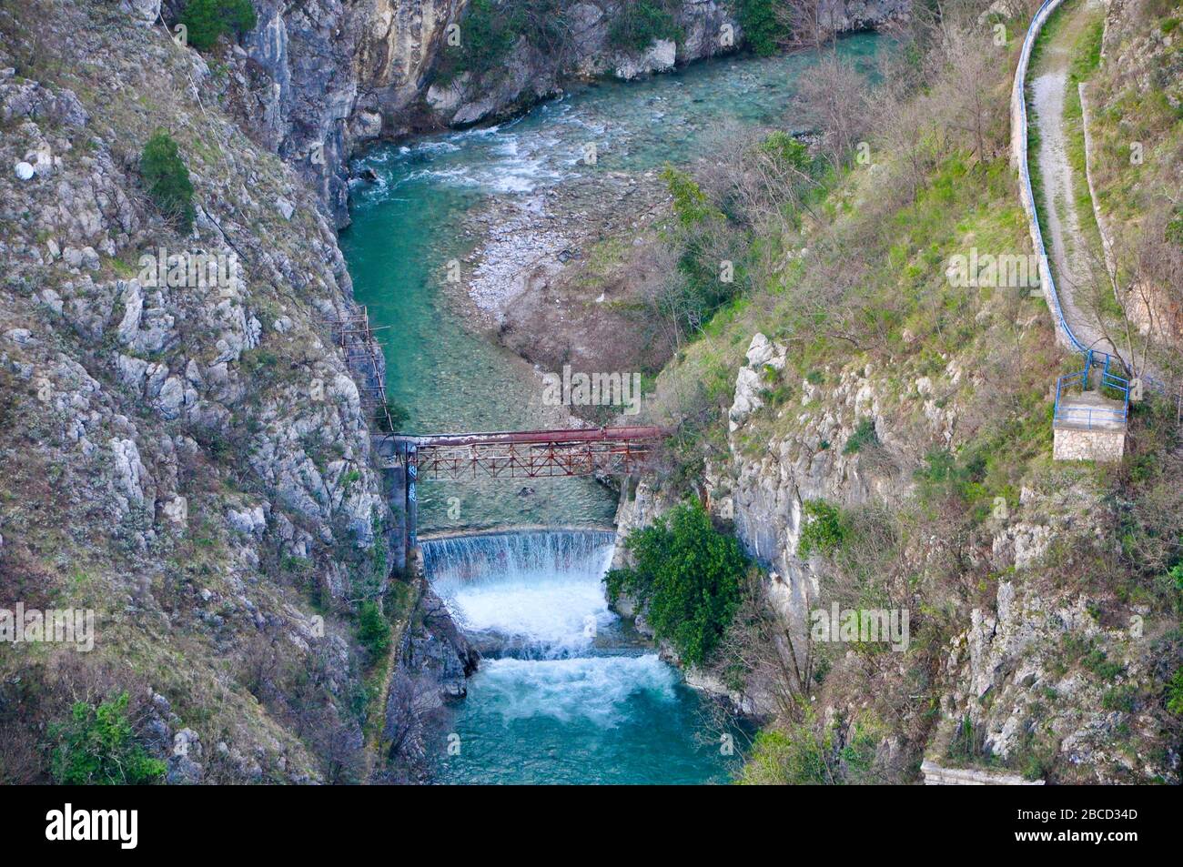 Rijeka river waterfalls at notch with old iron bridge. Pure nature ...