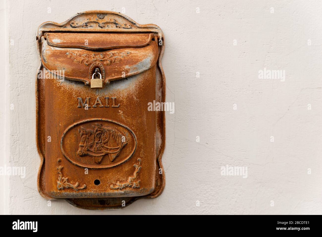 Close up of rusty iron post box on key outdoors. Vintage mailbox on ...