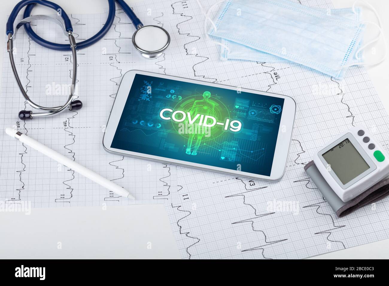 Tablet pc and doctor tools with COVID-19 inscription, coronavirus ...