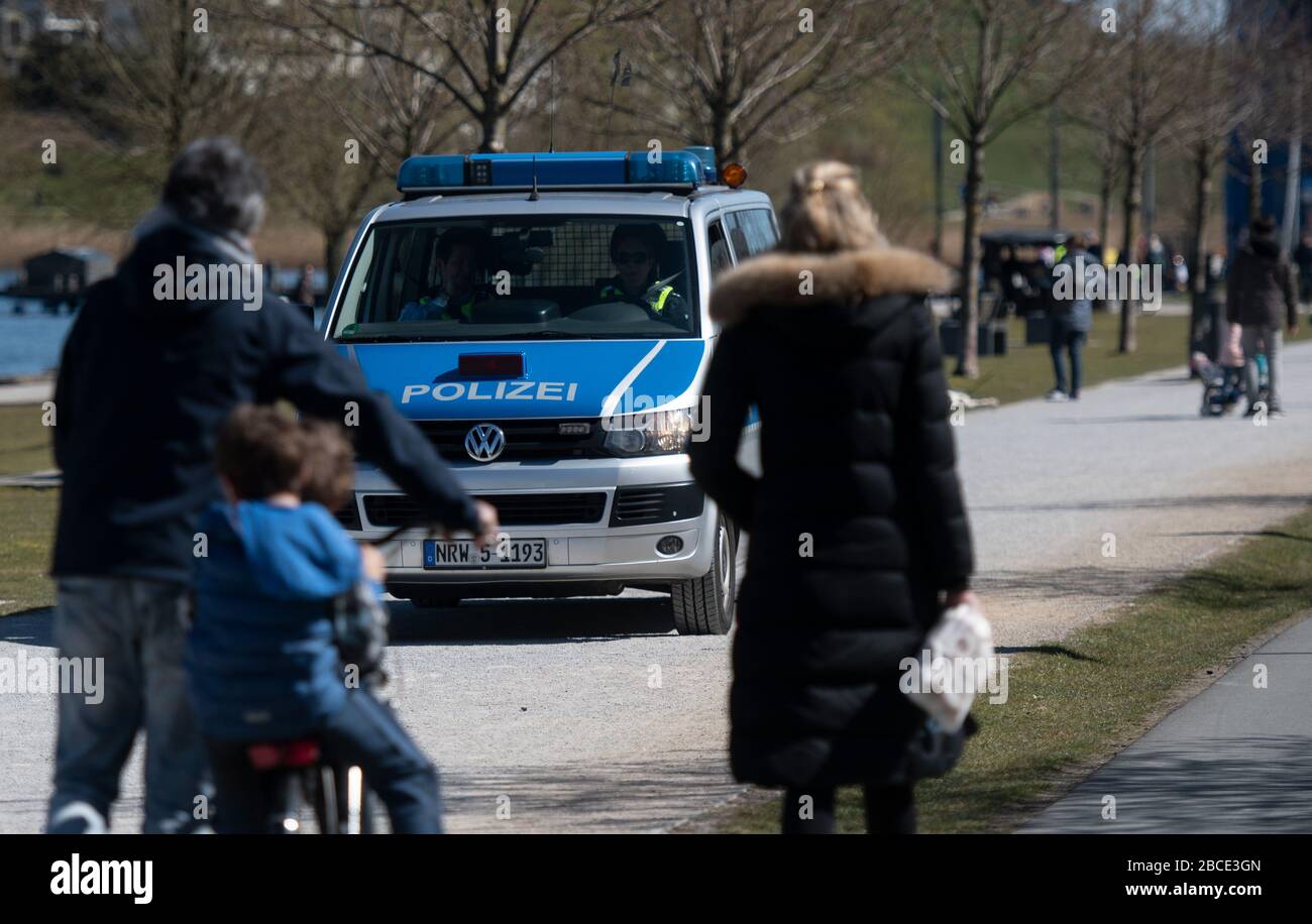 Dortmund, Germany. 04th Apr, 2020. A police car patrols the pedestrian ...