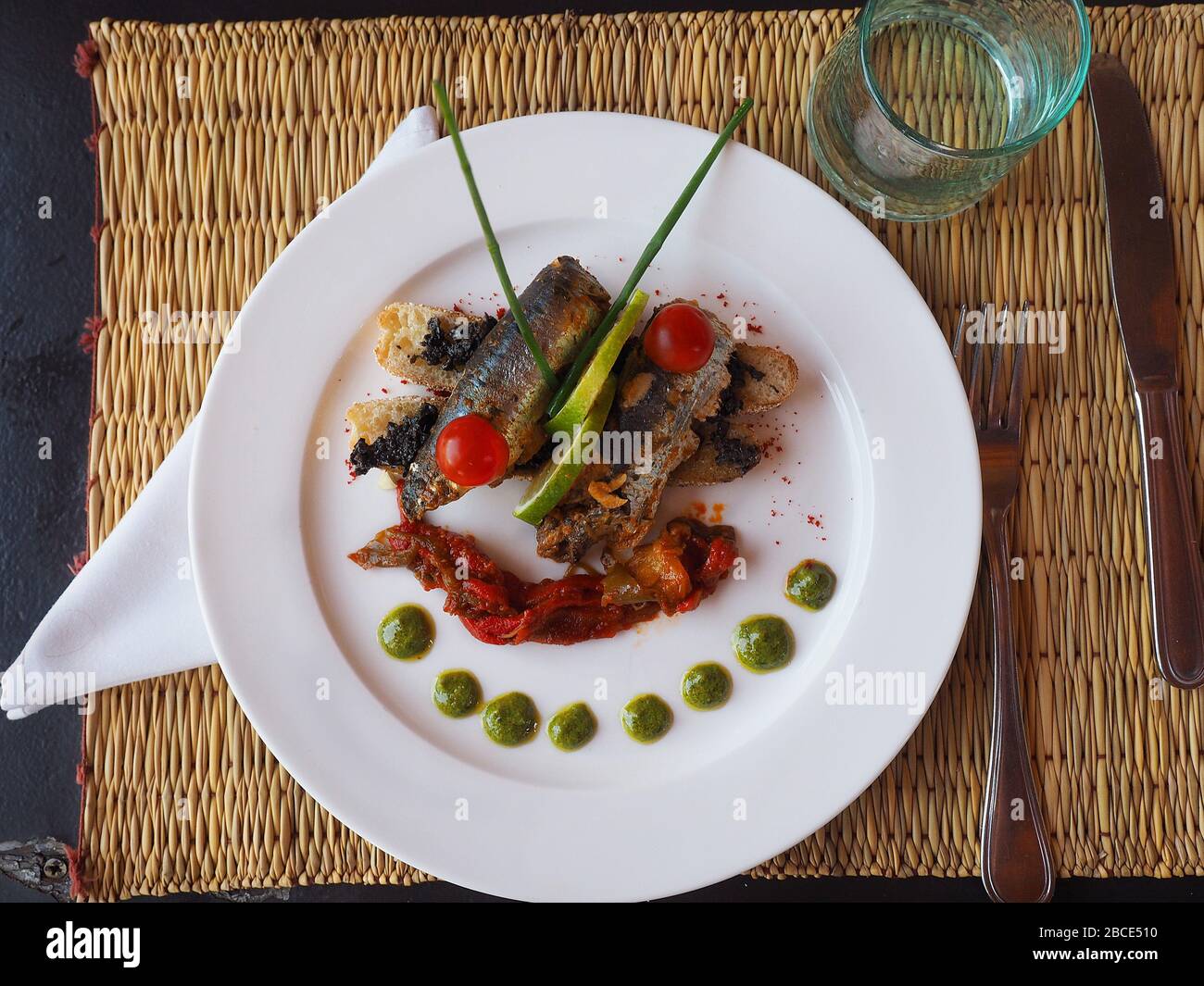 Lunch, traditional moroccan dish with sardines, peppers, tomatoes ...