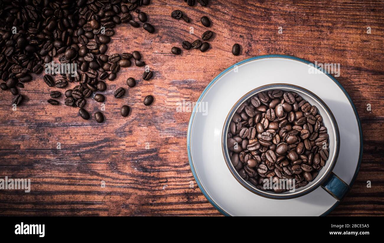 Flat Lay - Coffee & coffee beans in cup and saucer Stock Photo - Alamy