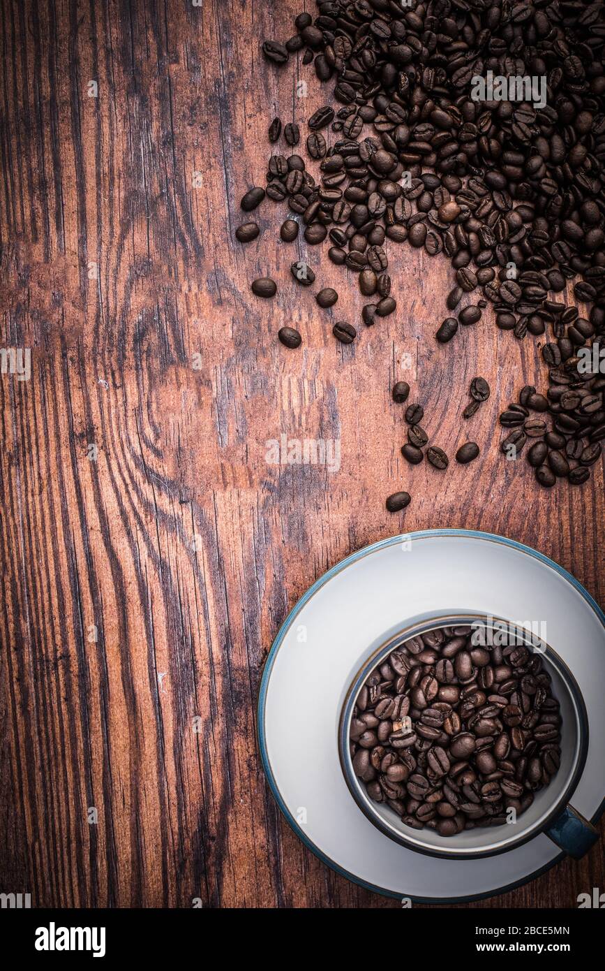 Flat Lay - Coffee & coffee beans in cup and saucer Stock Photo - Alamy