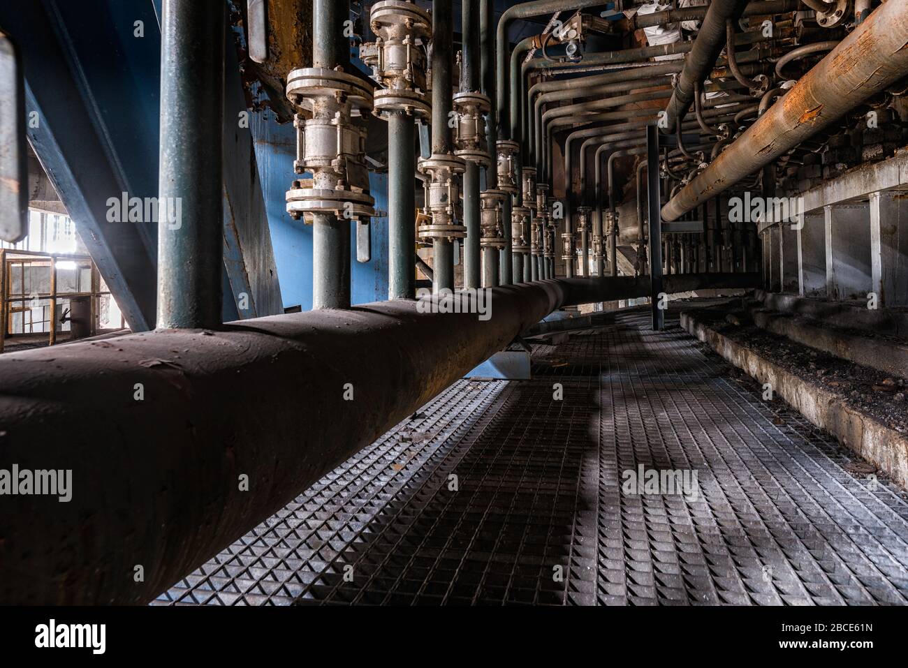 Interior of an old abandoned industrial steel factory Stock Photo - Alamy