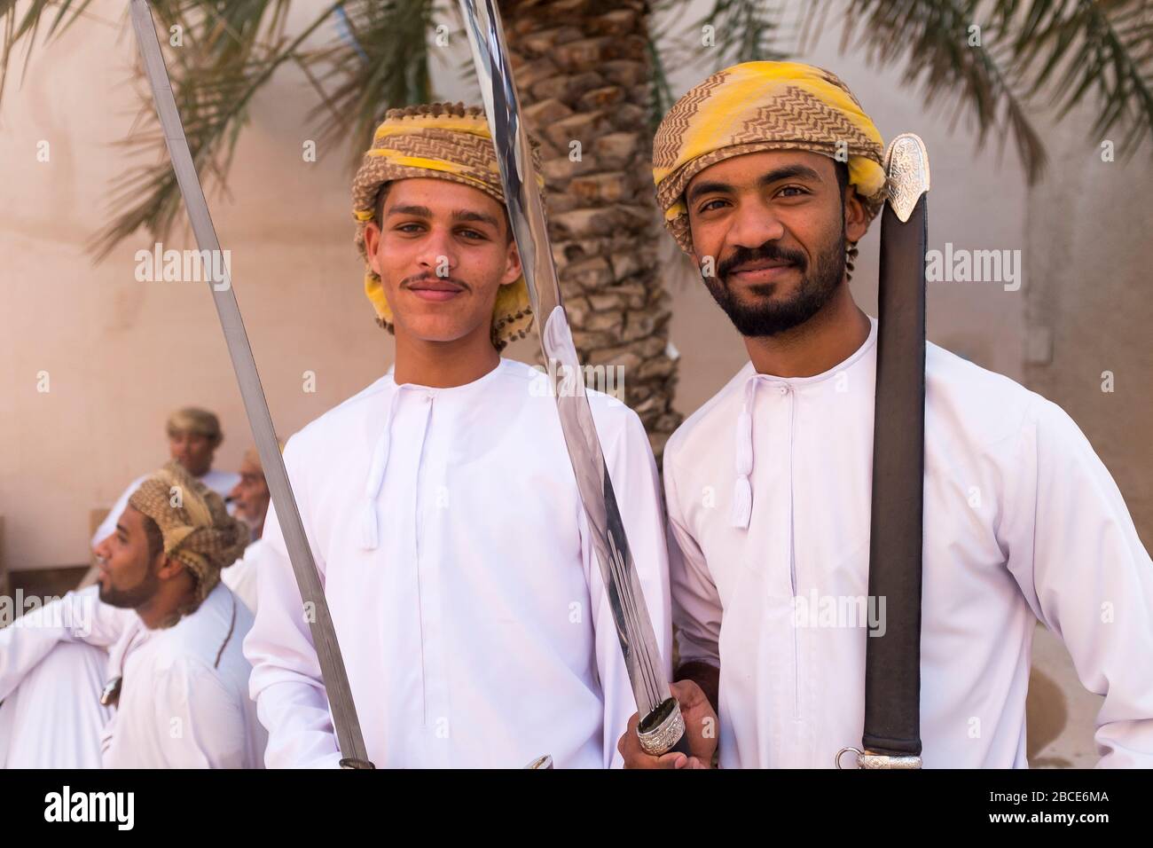 Traditional Omani sword dancers perform with musicians demonstrating ...
