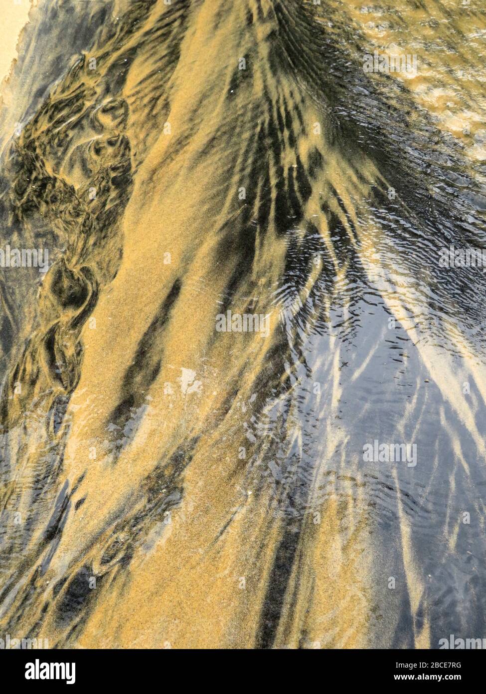 Sand patterns. Abstract wave art. Rivulets of glistening lines. Beach ...