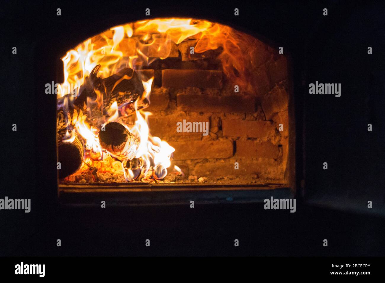 Oven on fire with woods, waiting for the dinner Stock Photo - Alamy