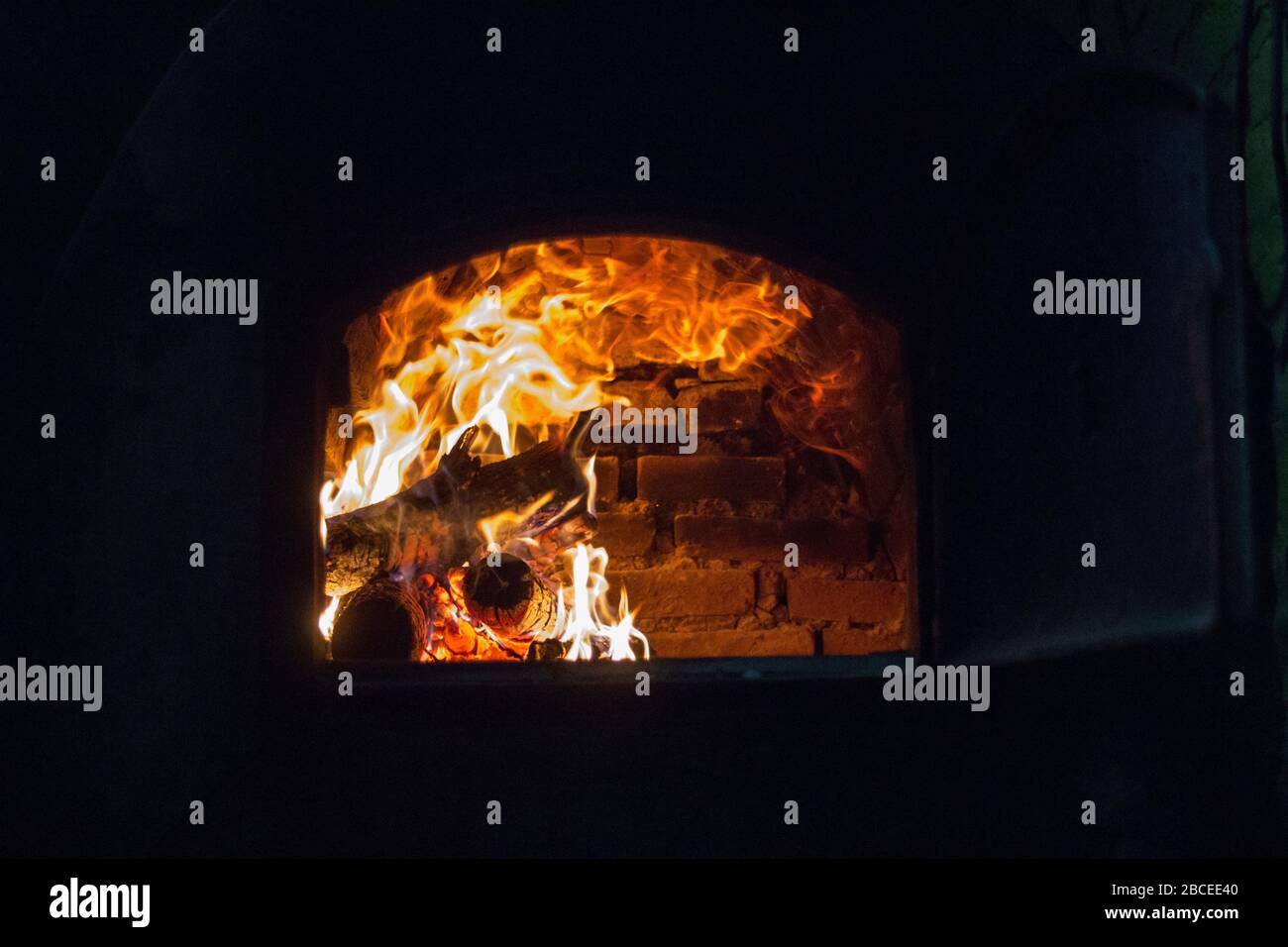 Oven on fire with woods, waiting for the dinner Stock Photo - Alamy
