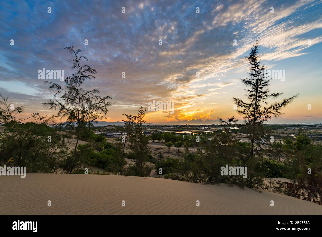 Scenery of sand dune with amazing sunset background Stock Photo - Alamy