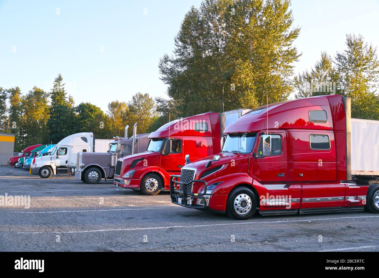 Resting place. Various types of trucks in the parking lot next to the ...