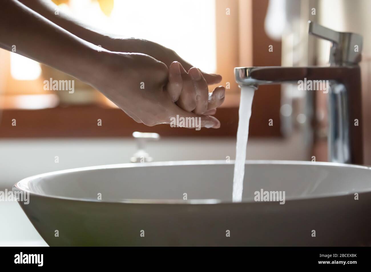 Young woman washing hands with bubble cleansing soap Stock Photo - Alamy