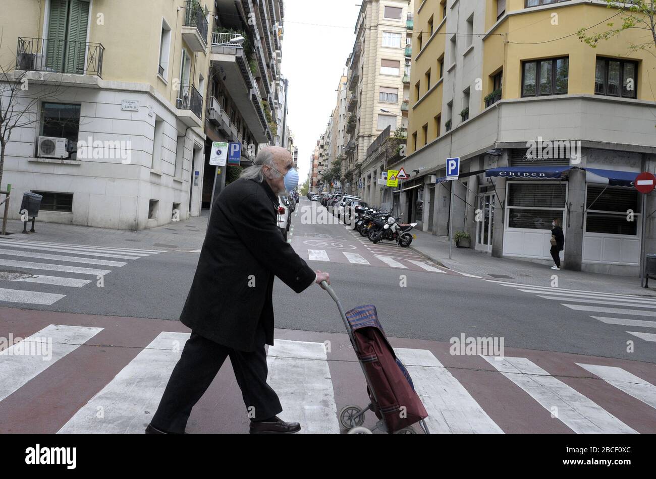 old man crossing the street going to shopping basics Stock Photo - Alamy
