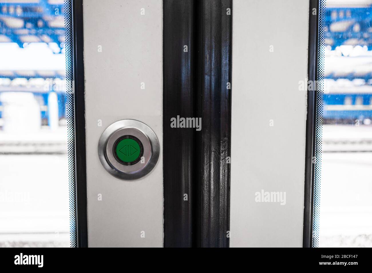 Button for opening doors in public transport Stock Photo - Alamy