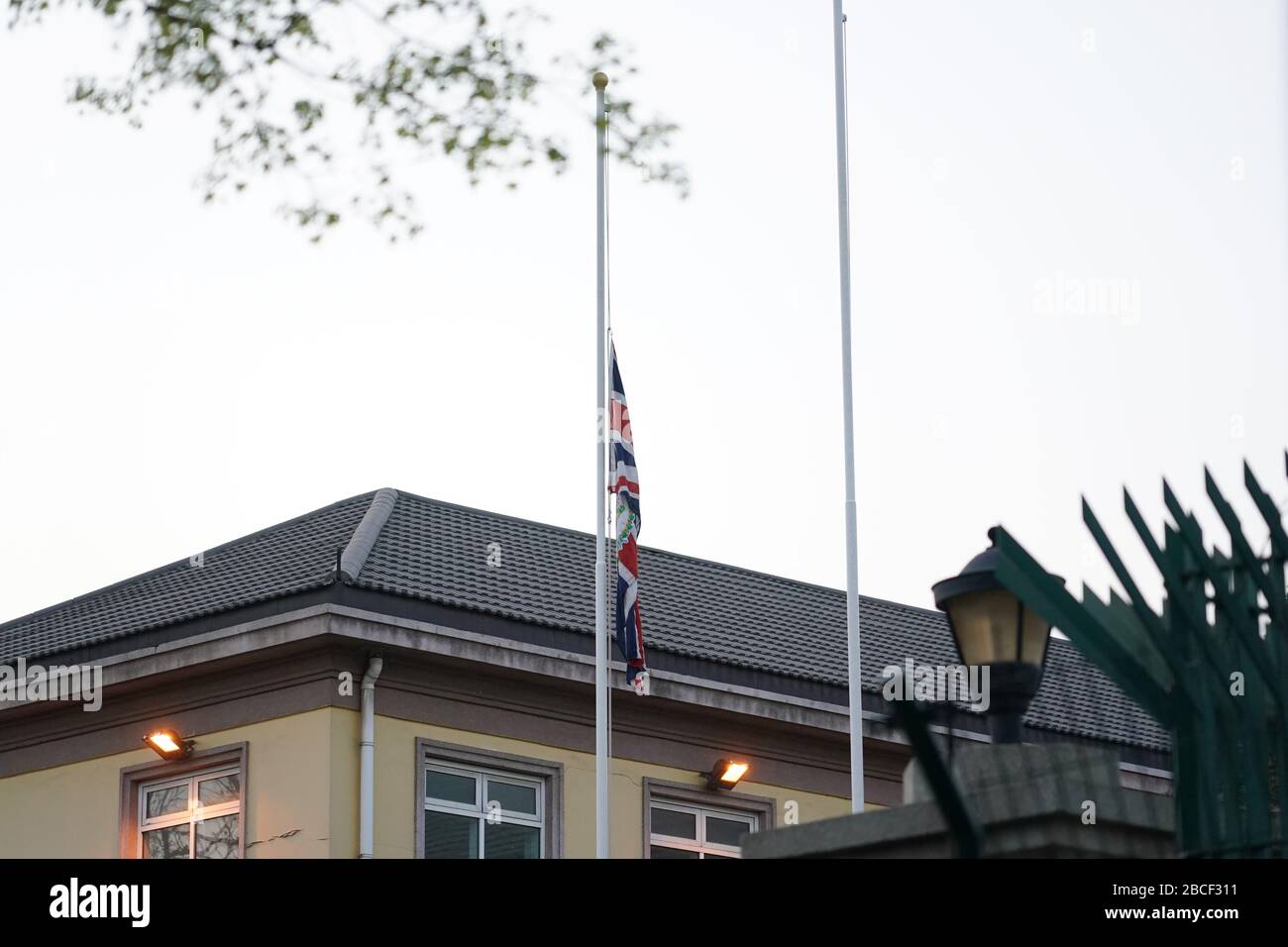 Beijing, China. 4th Apr, 2020. A British national flag flies at half ...