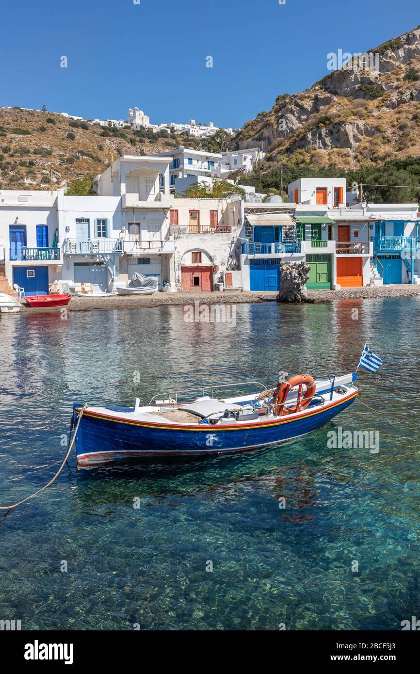 Boat Coloured houses in Klima beach with Trypiti village in background ...