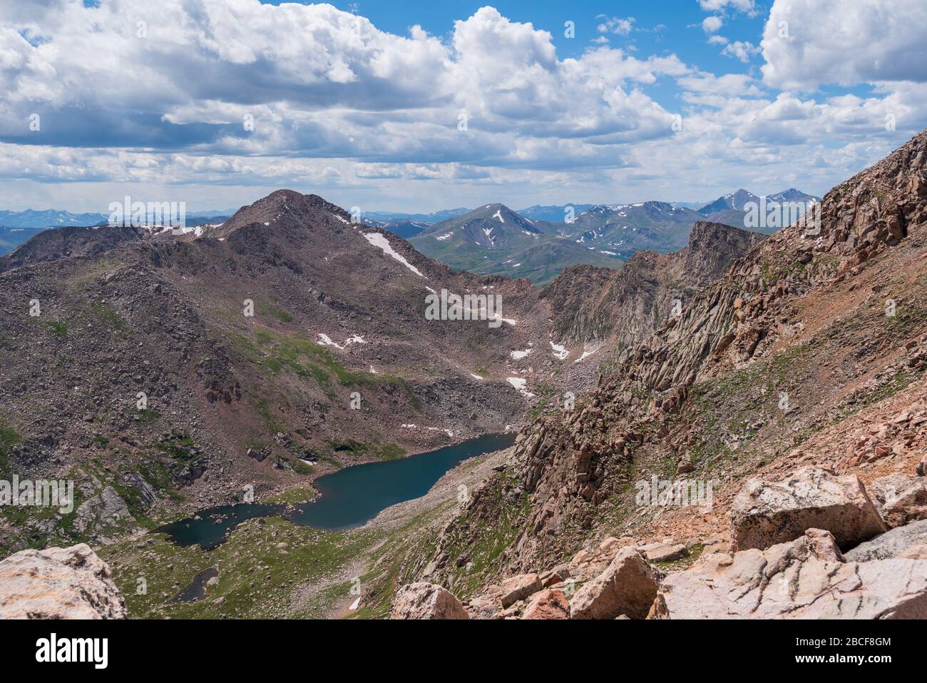 Landscape of mountain tops and a lake at the top of Mount Evans in ...