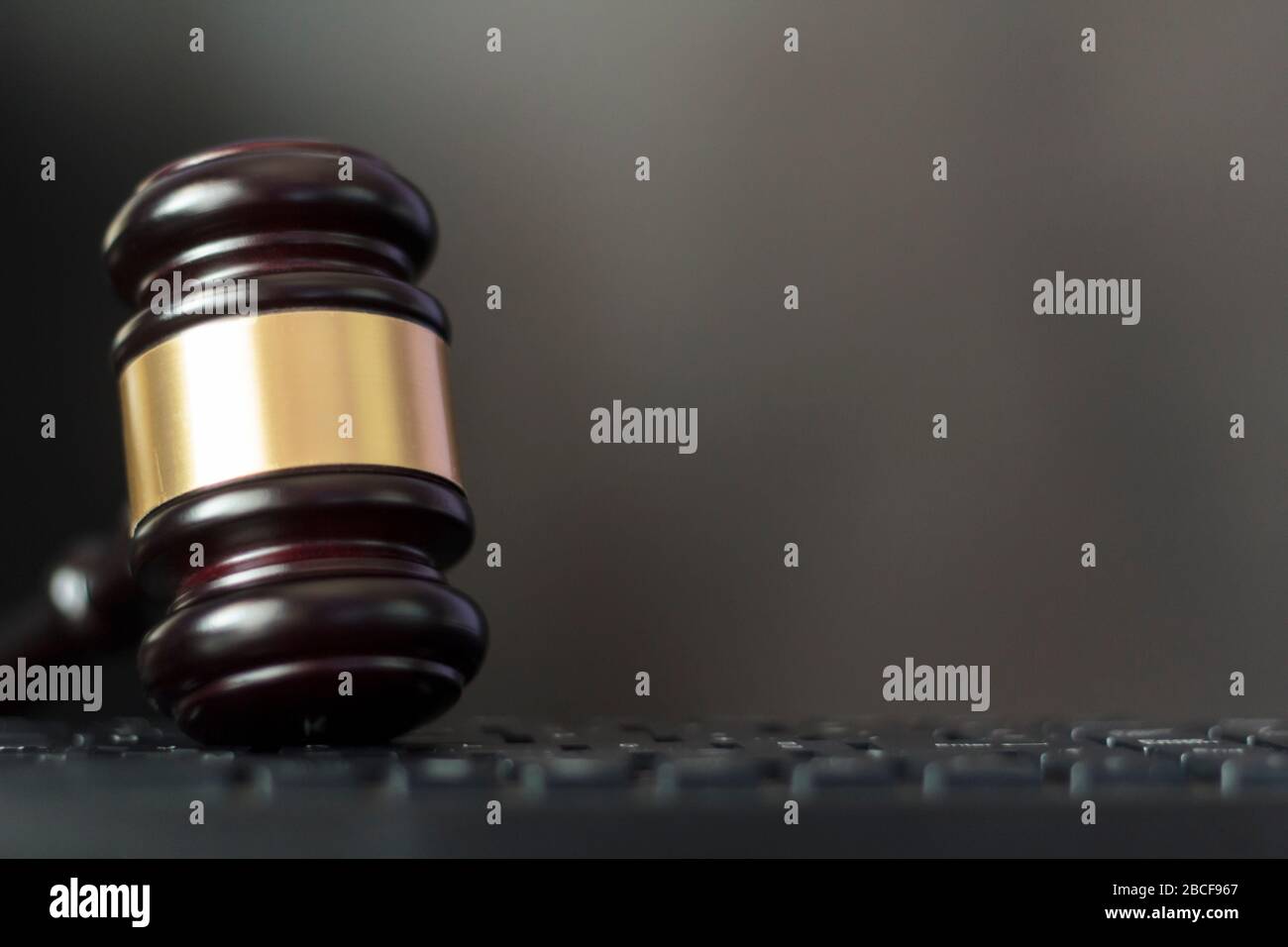Judge's gavel on computer keyboard with copy space. Cyber crime, law ...