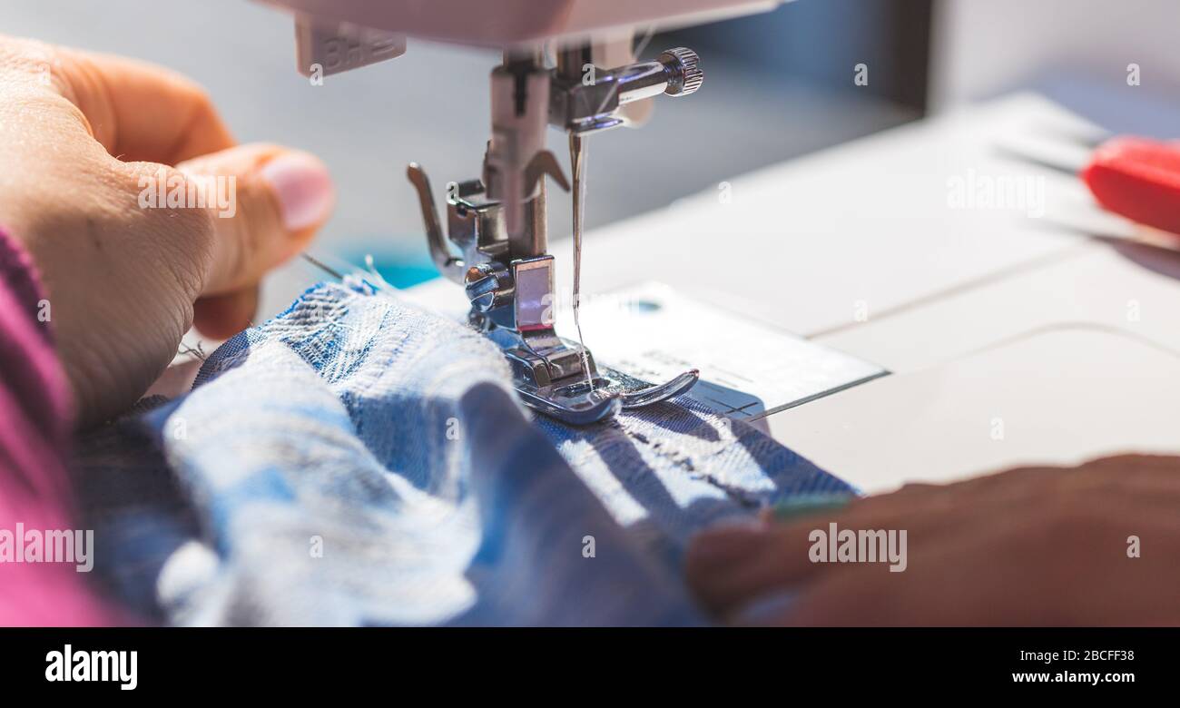 Close up of sewer working with textile and sewing needle Stock Photo ...