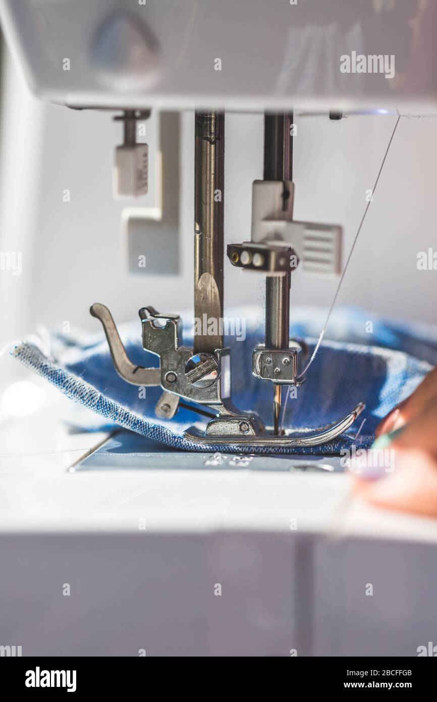 Close up of sewer working with textile and sewing needle Stock Photo ...