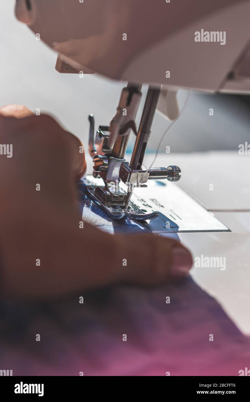 Close up of sewer working with textile and sewing needle Stock Photo ...