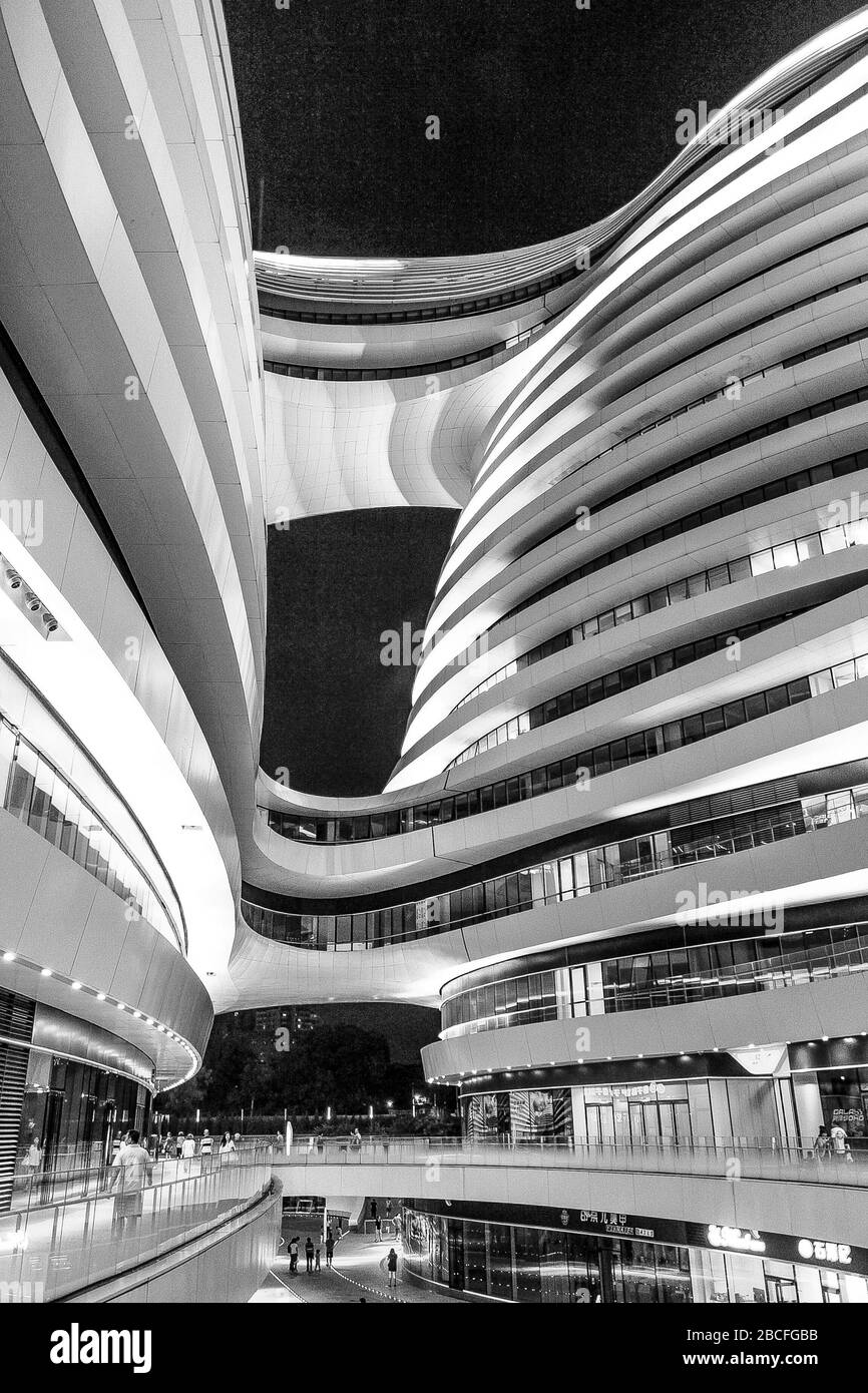 curve building at night in black and white Stock Photo - Alamy