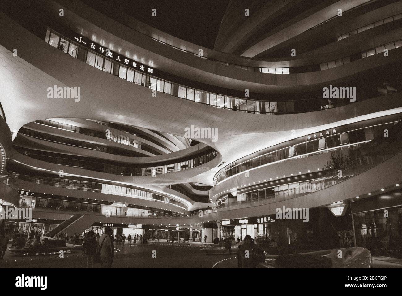curve building at night in black and white Stock Photo - Alamy