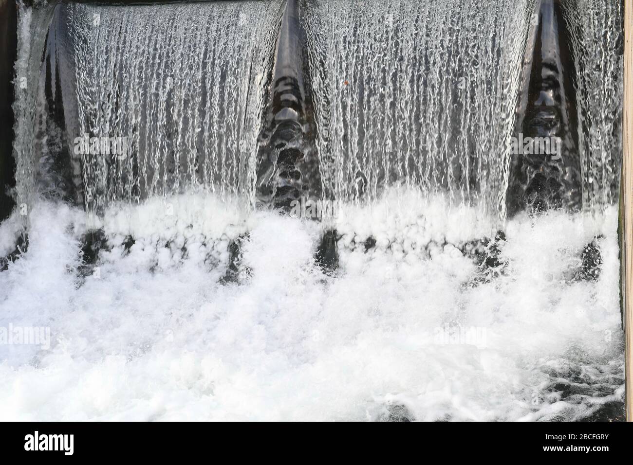 Flowing water on a waste treatment plant Stock Photo - Alamy