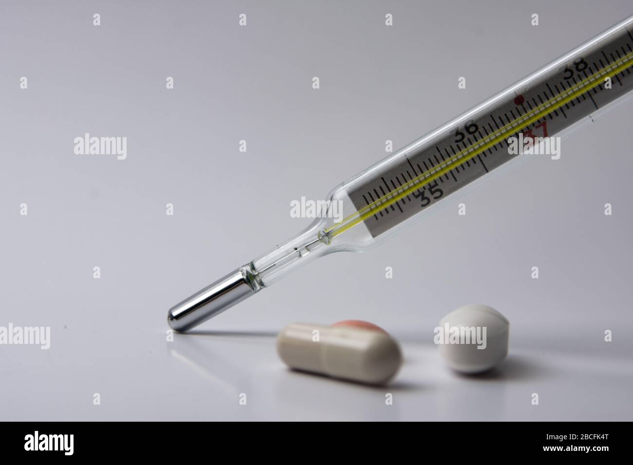 pill packs, industial thermometer with colorful medicaments lying on ...
