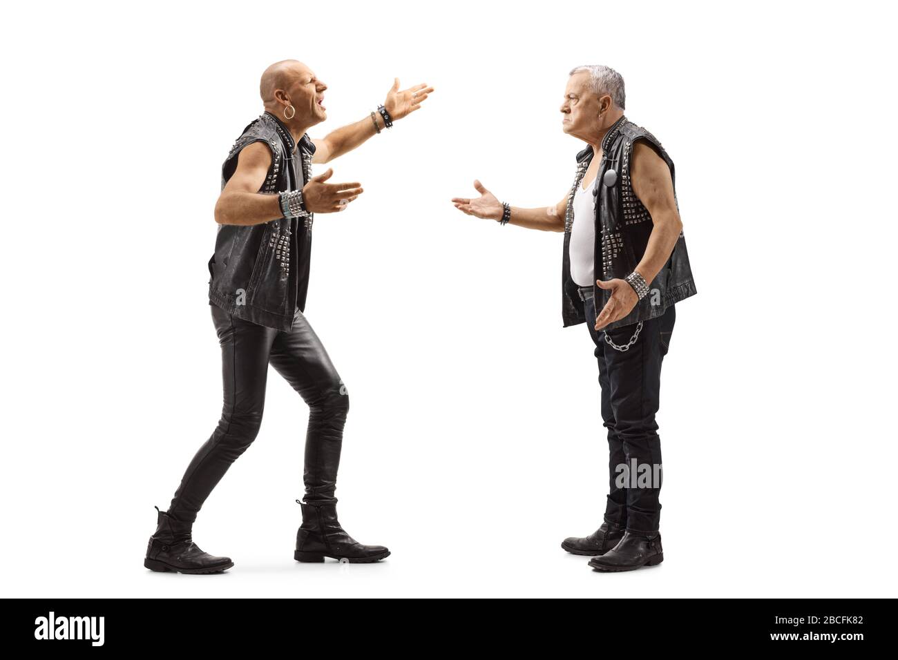 Full length profile shot of two angry punk men having an argument ...
