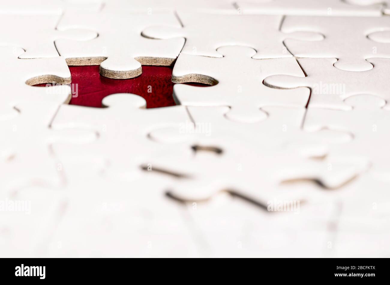 close up of a jigsaw over a black background. problem solving. business ...